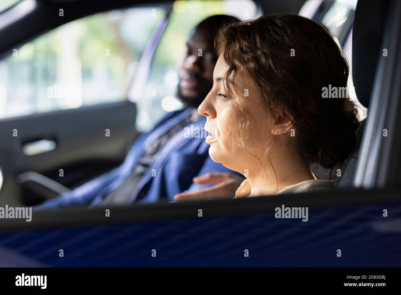 Husband and wife doing car test drive to catch any warning signs before ...