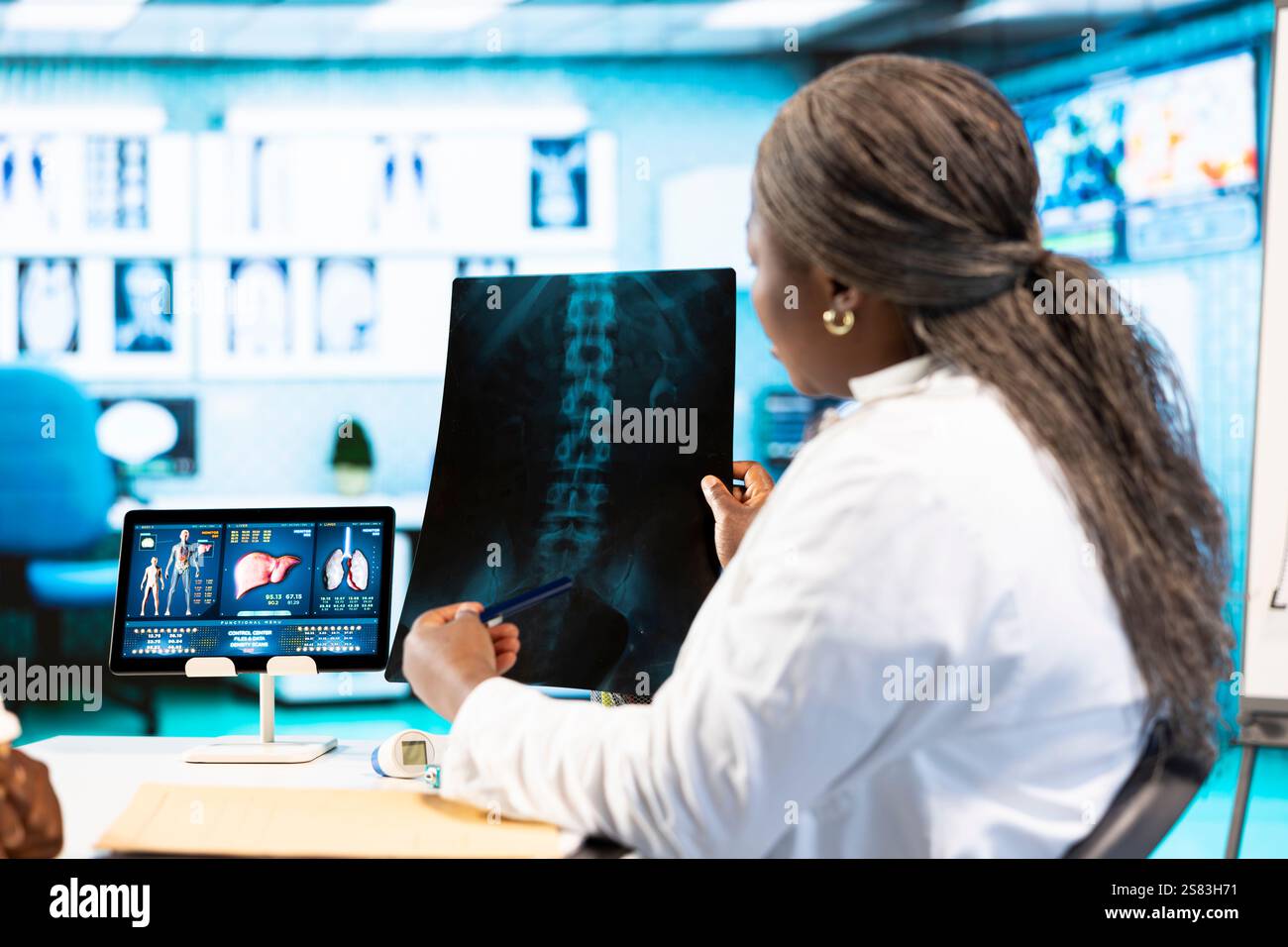 Medical interaction between a doctor and male patient with spinal pain ...