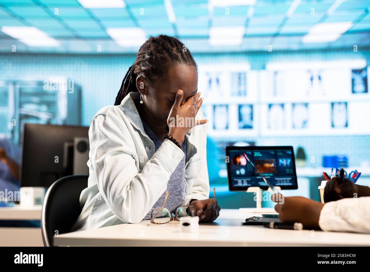 African american female doctor discussing a scary cancer diagnosis with ...