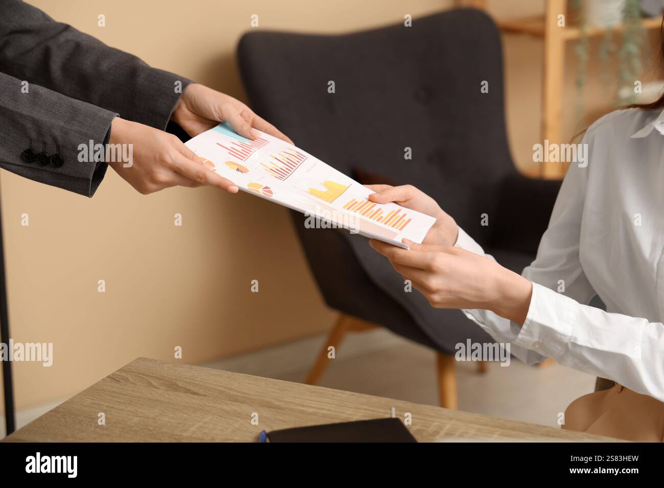 Female secretary giving business documents hi-res stock photography and ...