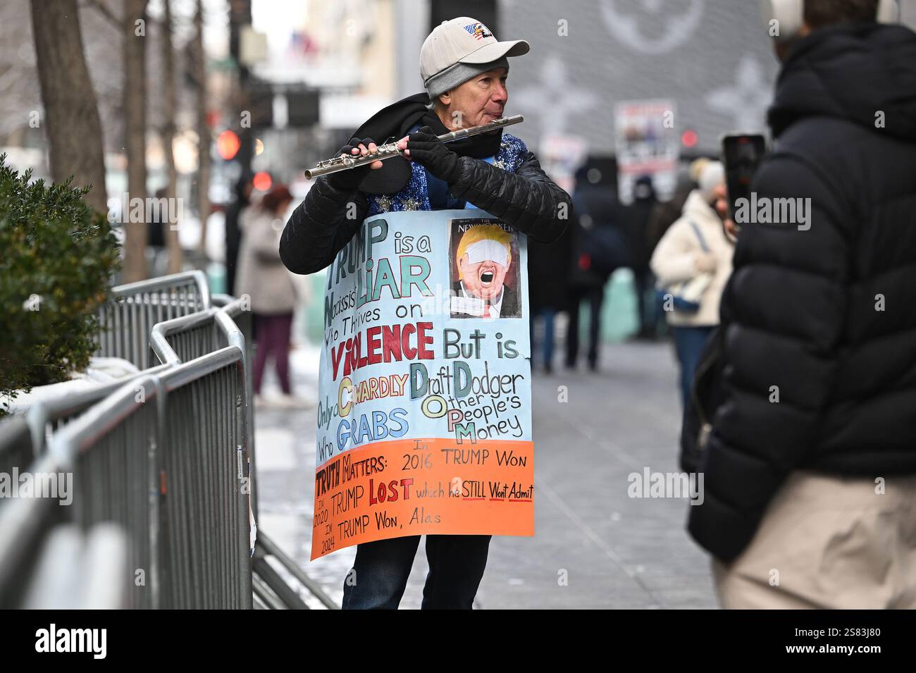 New York, USA. 20th Jan, 2025. Marc Leavitt plays his flute outside of ...