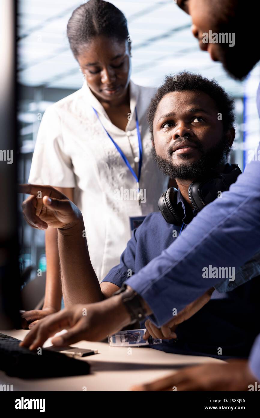 Data center coworkers doing brainstorming, using programming languages to construct algorithms ...