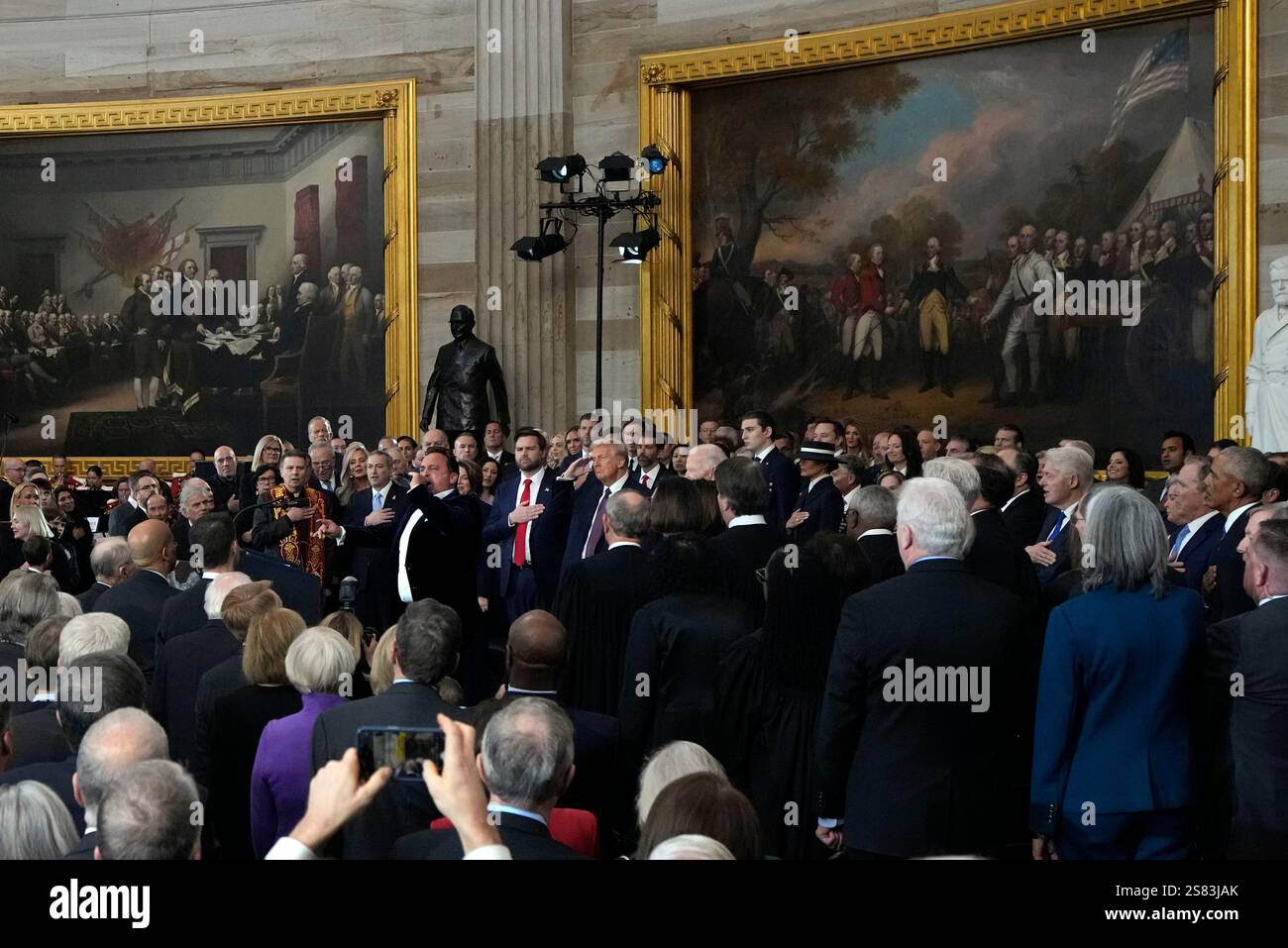 President Donald Trump and Vice President JD Vance listen to ...
