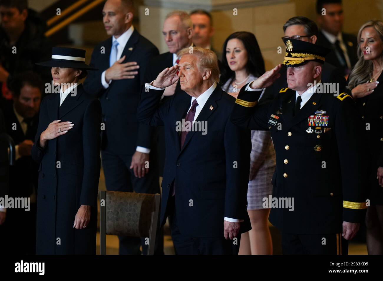 President Donald Trump salutes during a review of the troops in ...
