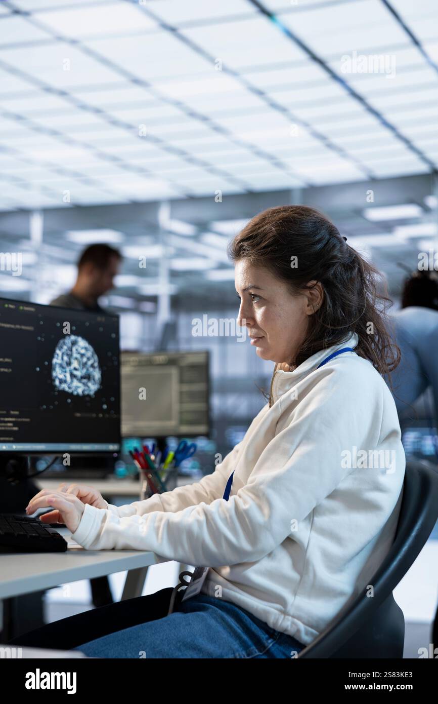 System administrator monitoring supercomputer hi-res stock photography ...