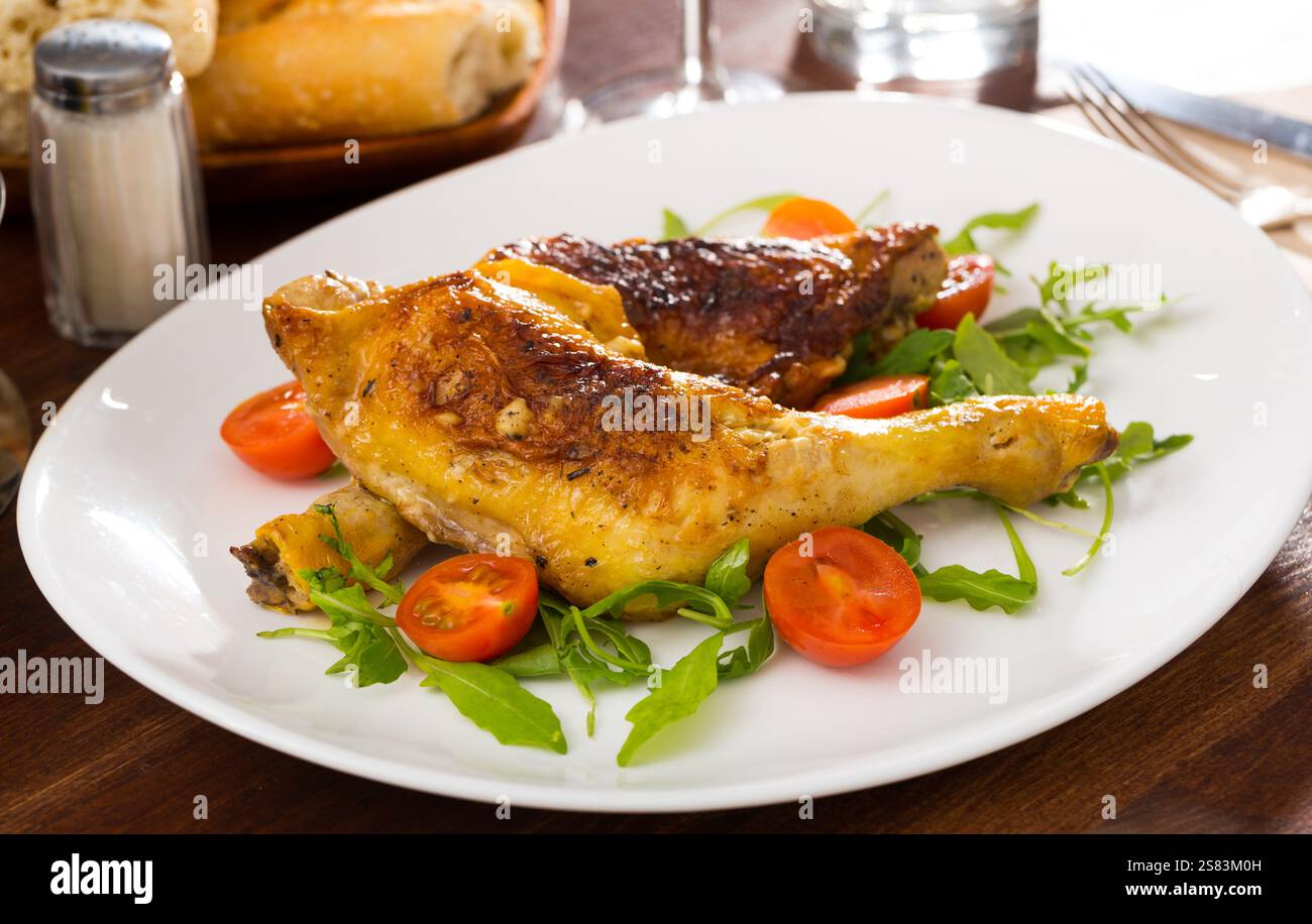 Roasted chicken legs with golden crust Stock Photo - Alamy