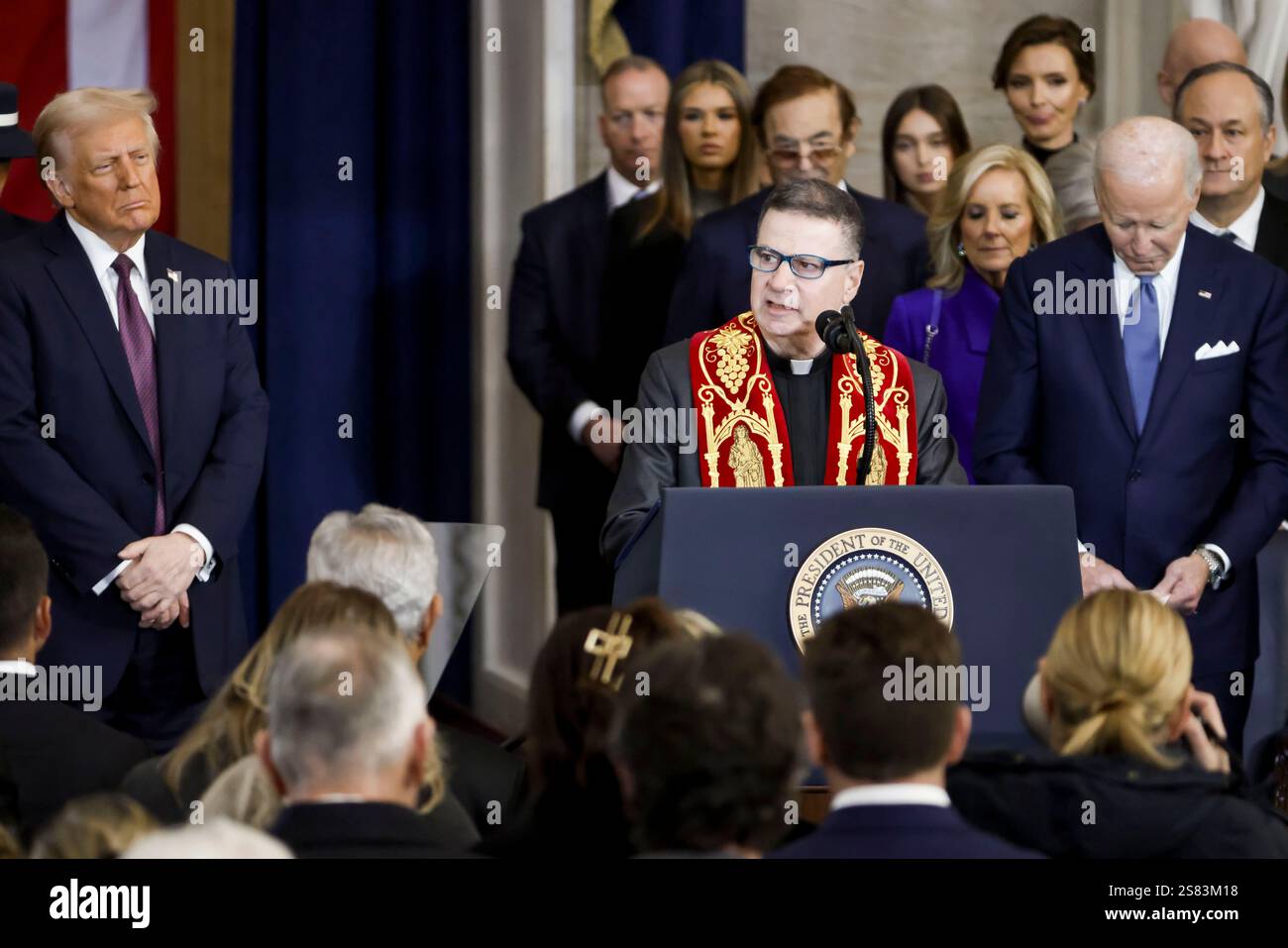 Rev. Father Frank Mann (C) of the Roman Catholic Diocese of Brooklyn ...