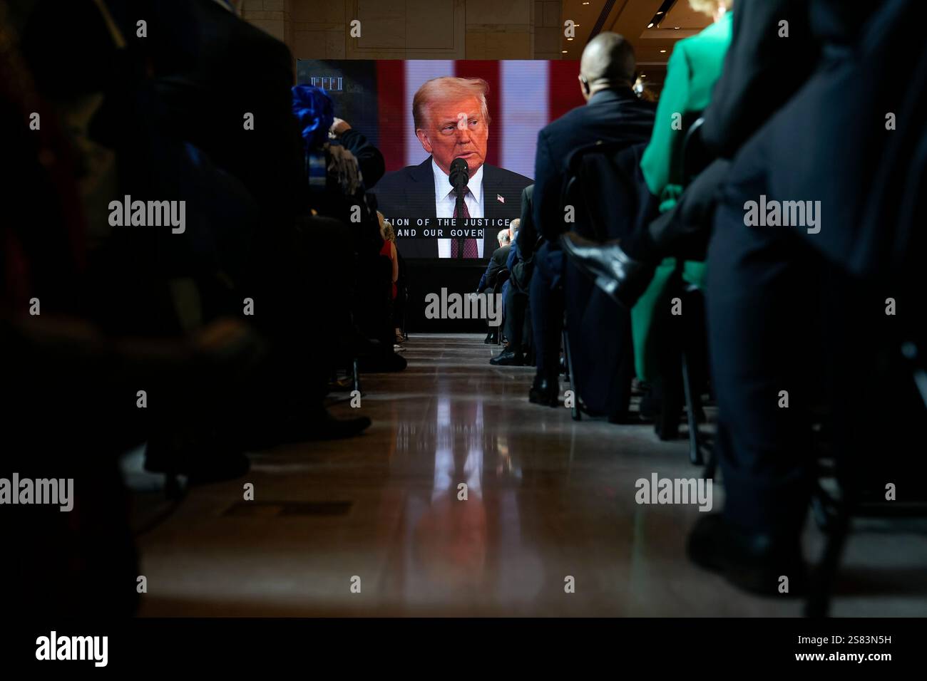 Guests and supporters are seen in an overflow room in Emancipation Hall ...