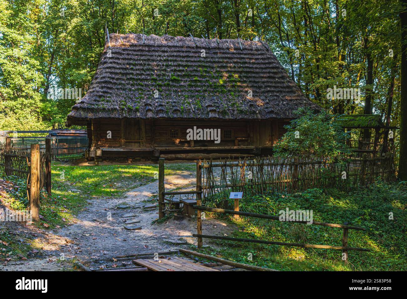 Explore local history at a rustic museum with thatched roof charm Stock ...
