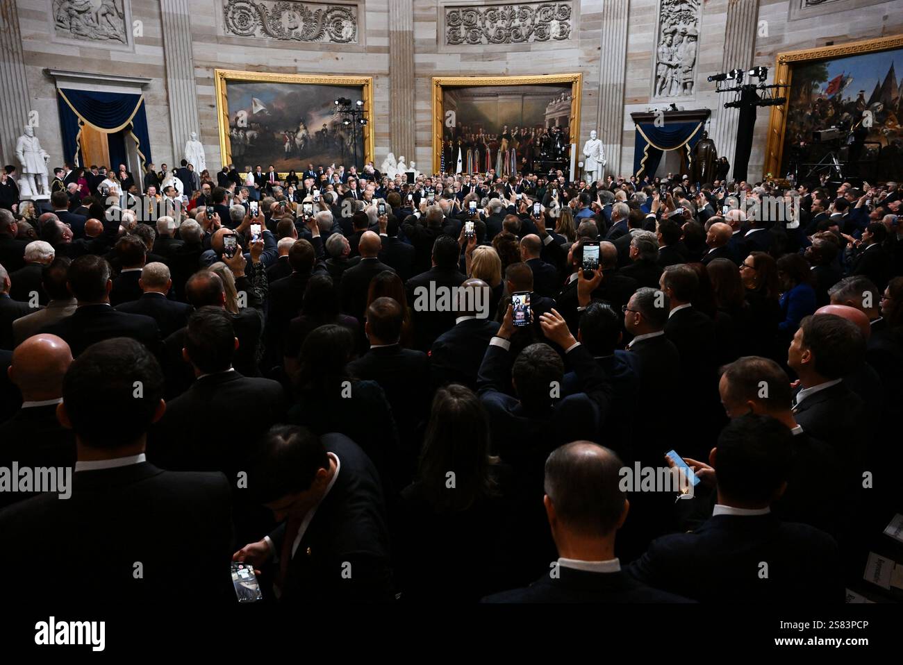 Washington, United States. 20th Jan, 2025. Attendees sit in the Rotunda ...