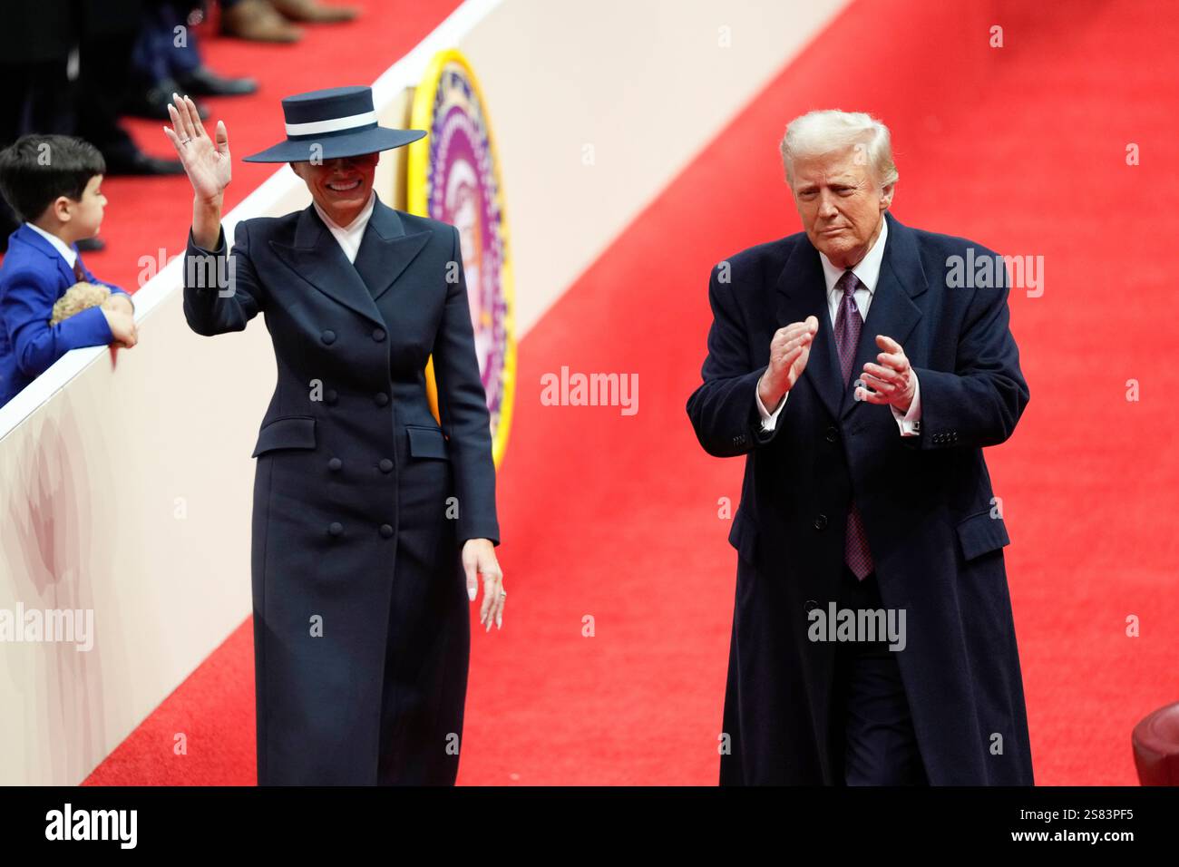 President Donald Trump and first lady Ivanka Trump, arrive at an indoor ...