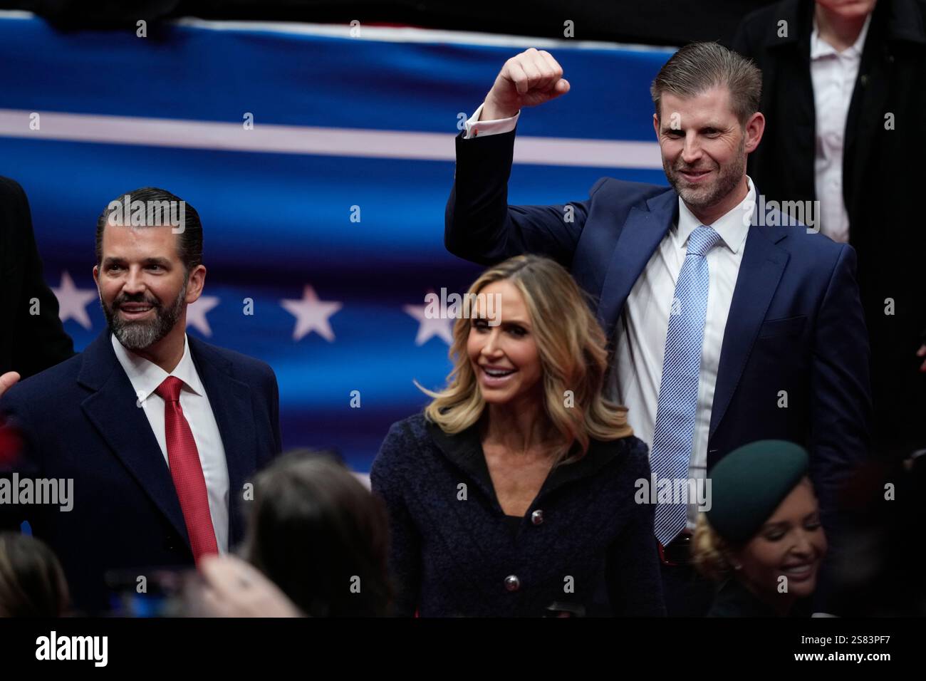 Donald Trump, Jr., Laura Trump and Eric Trump, attend an indoor ...