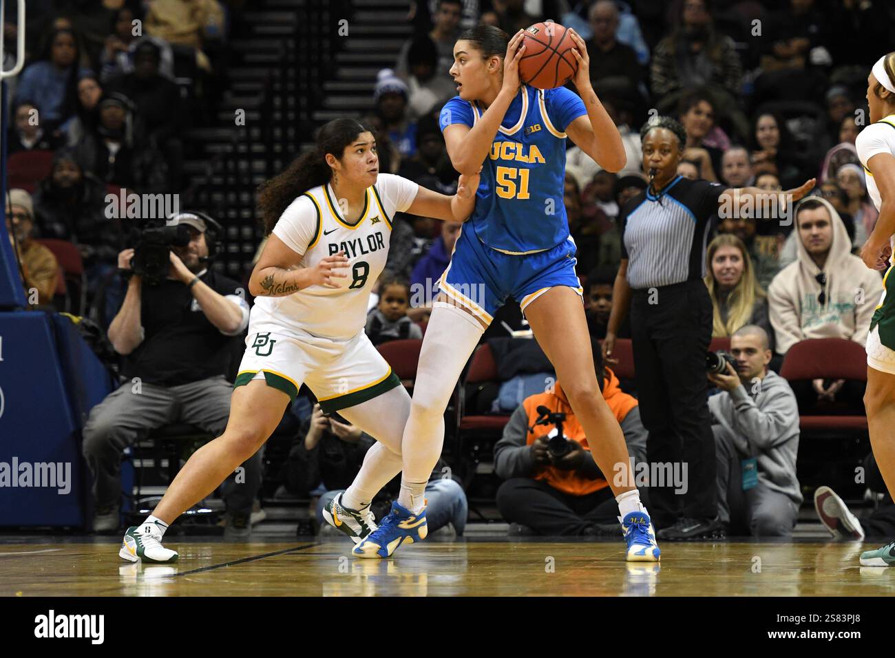 UCLA center Lauren Betts (51) looks to pass the ball past Baylor ...