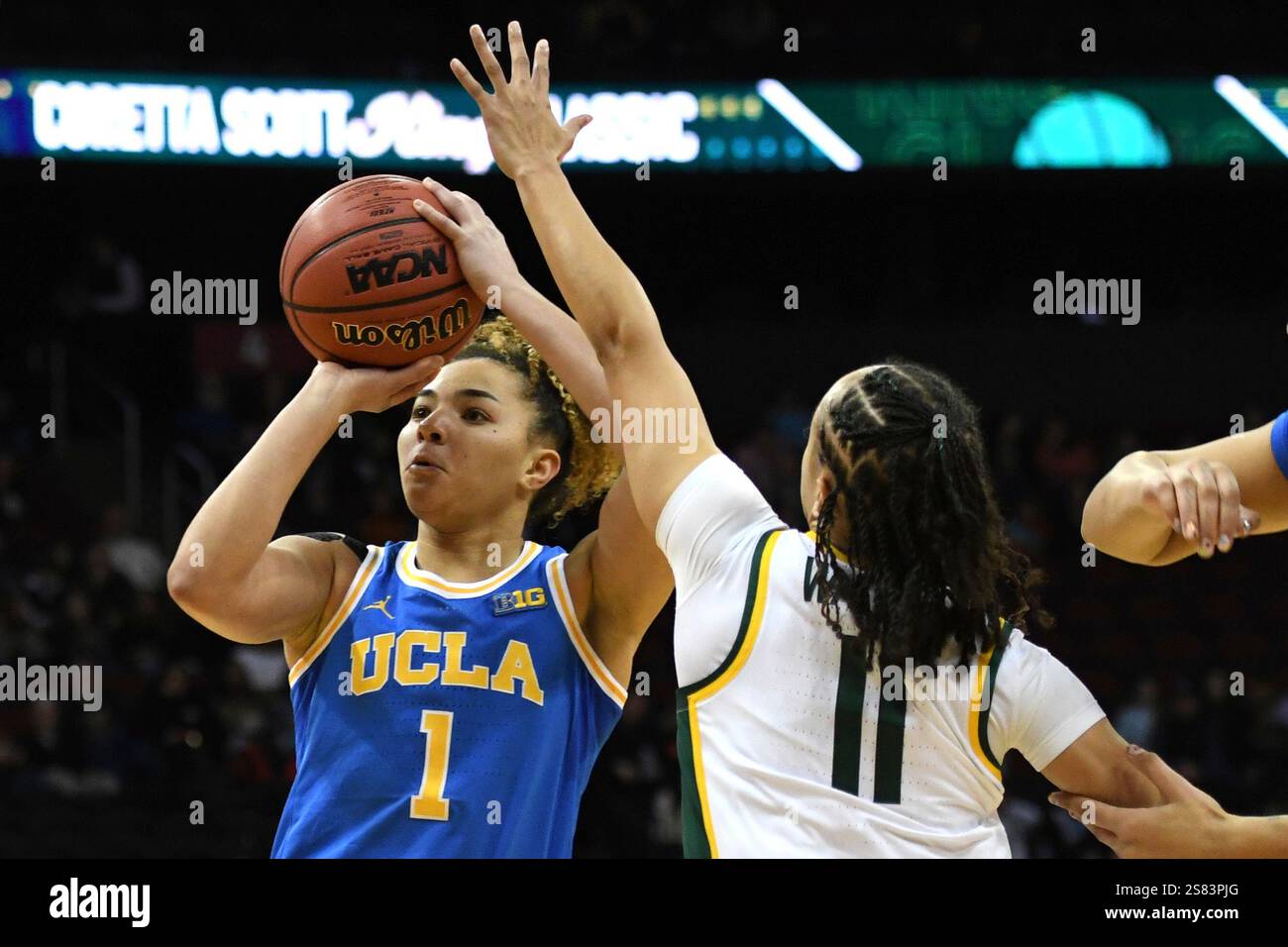 UCLA guard Kiki Rice, left, looks to shoot the ball against Baylor ...