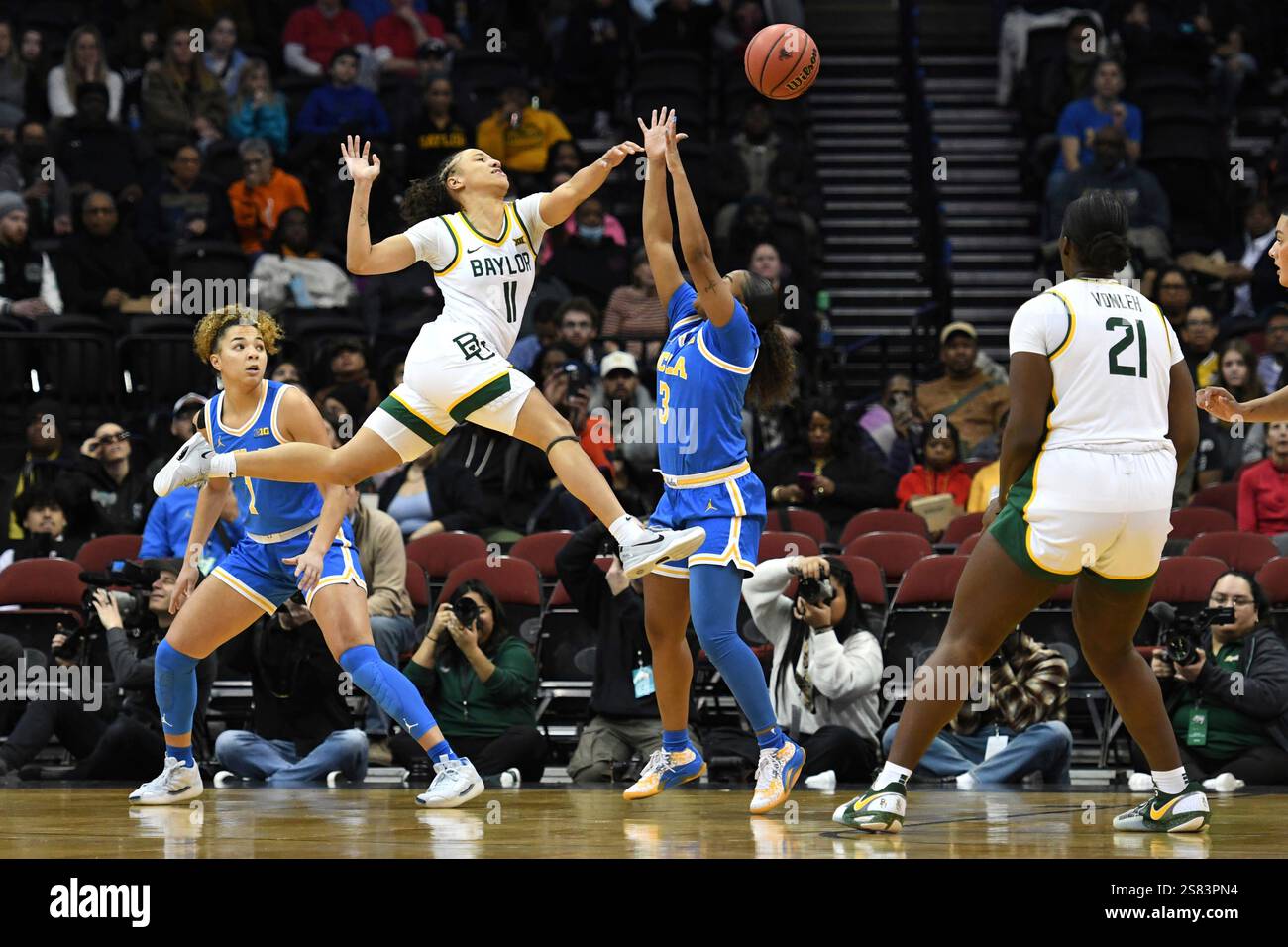 Baylor guard Jada Walker (11) attempts to pass the ball over UCLA guard ...