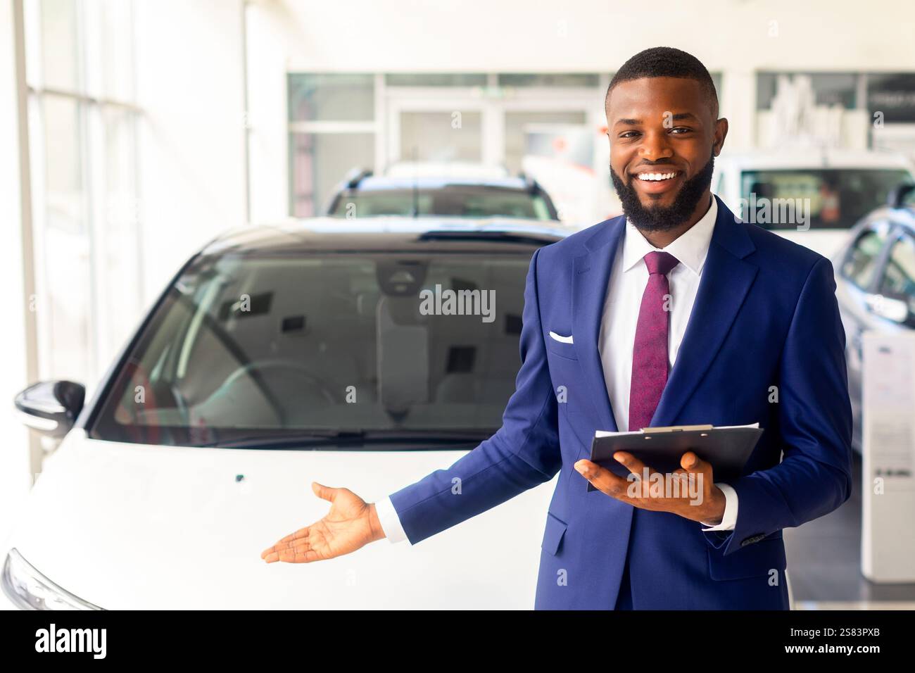 Handsome Black Manager In Suit Posing At Workplace In Car Dealership ...