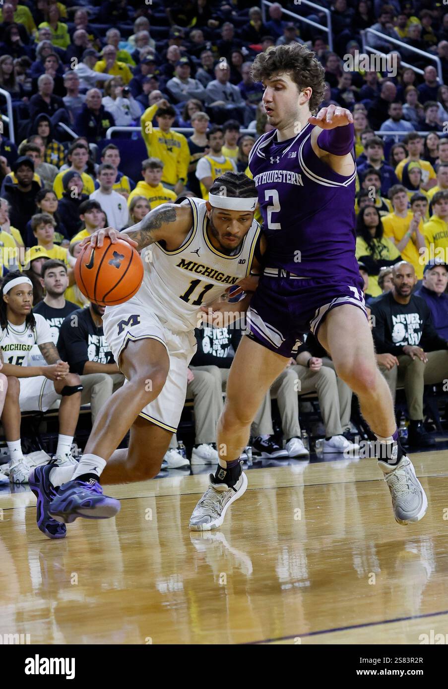 Michigan guard Roddy Gayle Jr. (11) drives against Northwestern forward ...