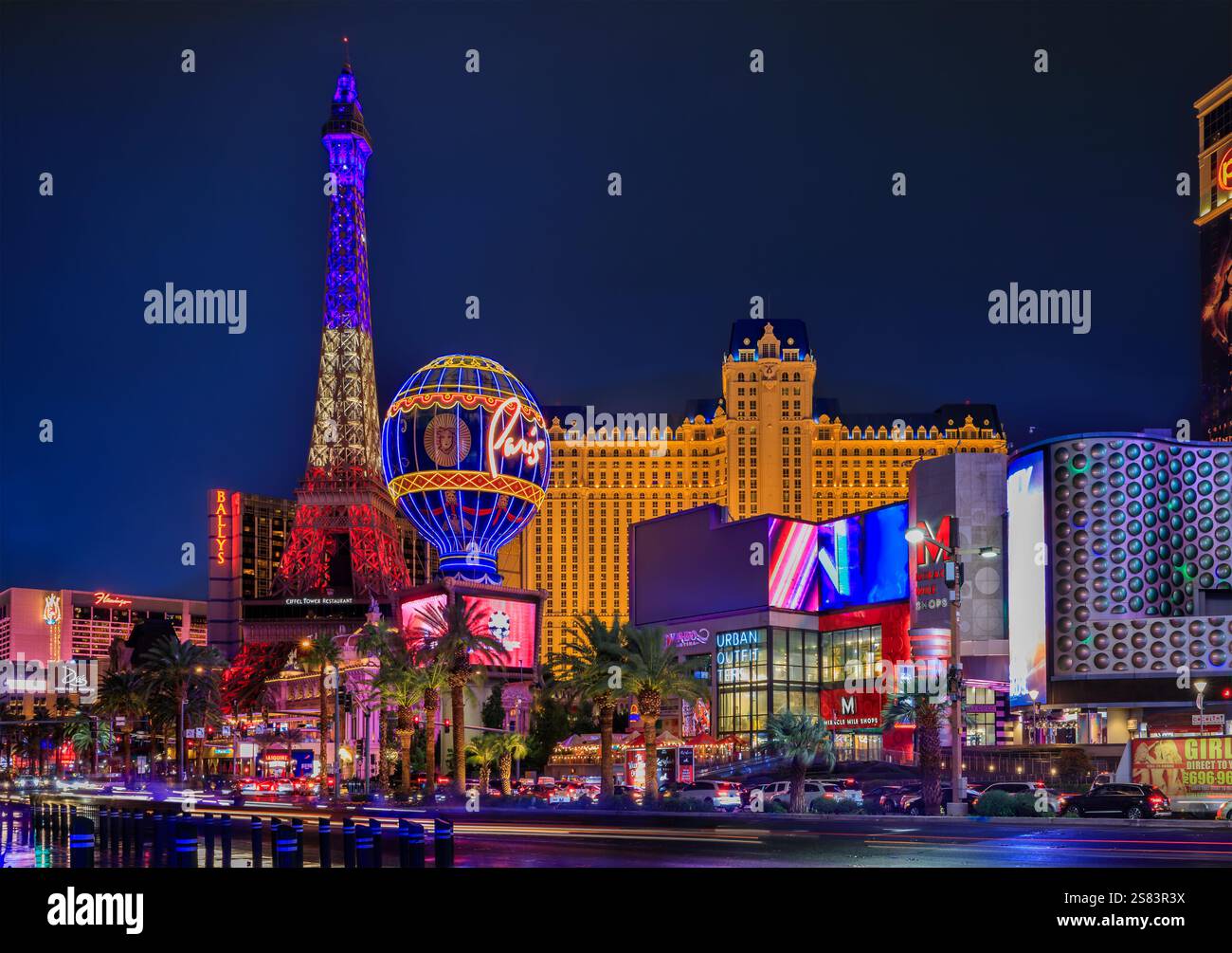 Las Vegas, Nevada, USA - October 25, 2021: The Strip at night, Eiffel Tower replica, hot air ...