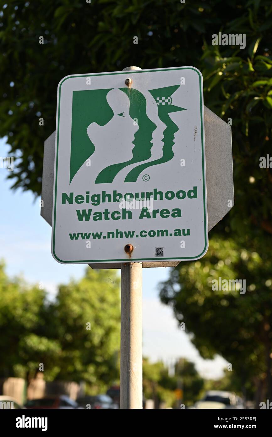 Rectangular Neighbourhood Watch Area sign, with a tree-lined suburban ...