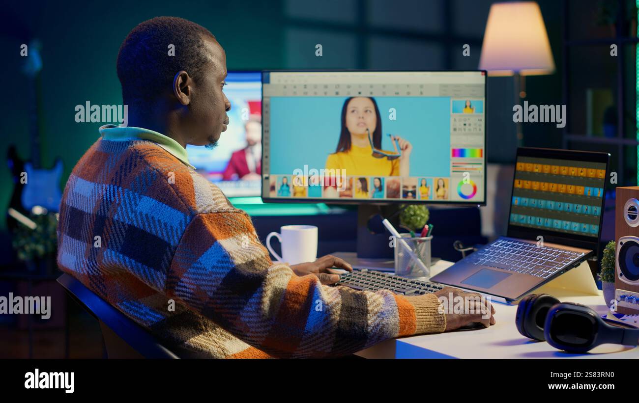 Freelance graphic designer working from home office on editing photos ...