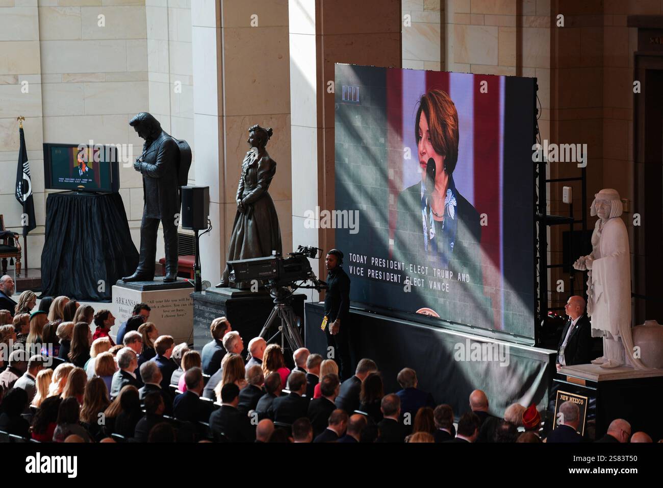 Washington, Dc, USA. 20th Jan, 2025. Attendees watch a livestream in Emancipation Hall showing ...