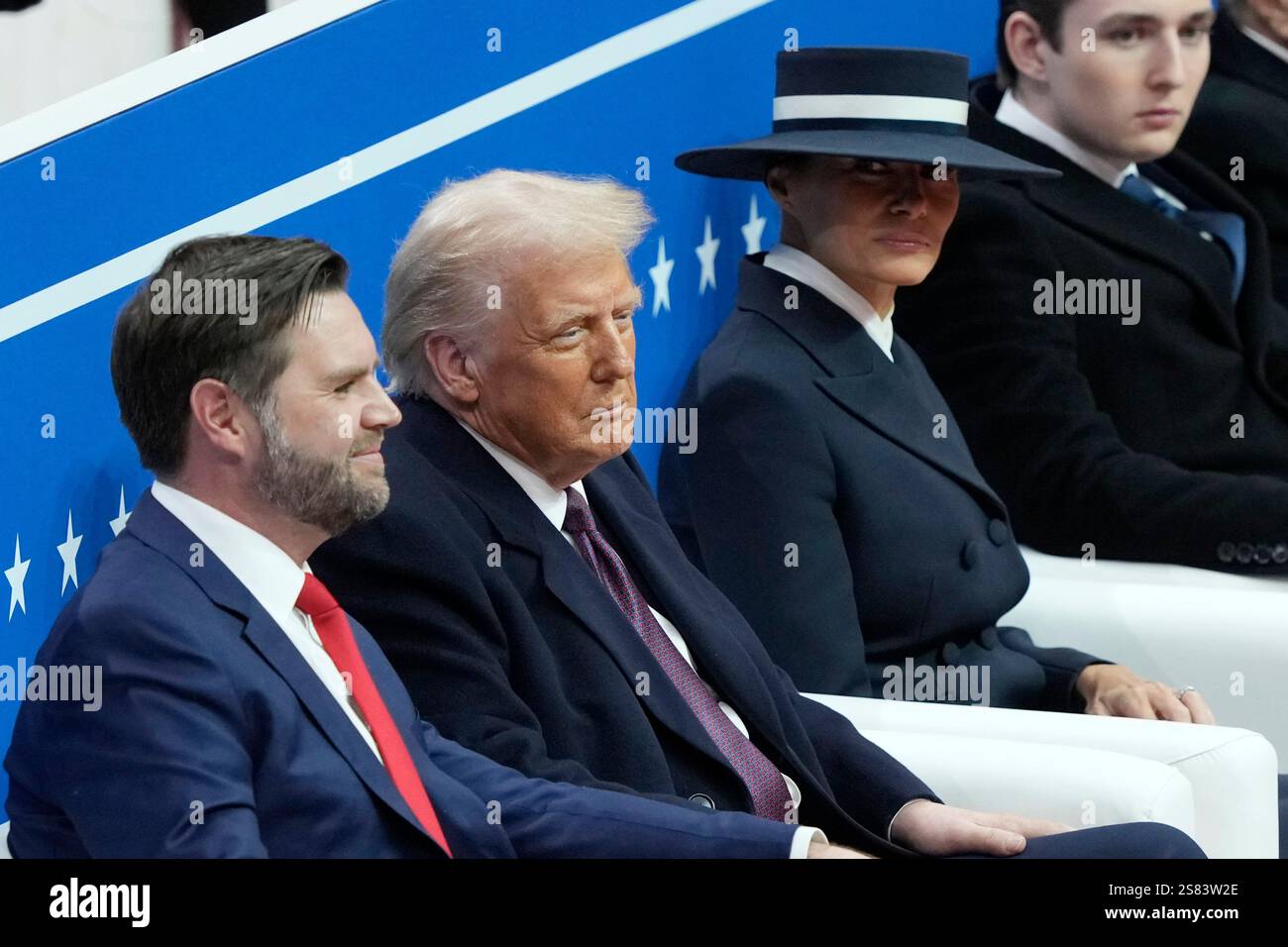 President Donald Trump sits with Vice President JD Vance, left, and ...