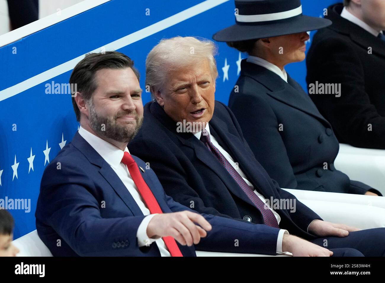 President Donald Trump sits with Vice President JD Vance, left, and ...