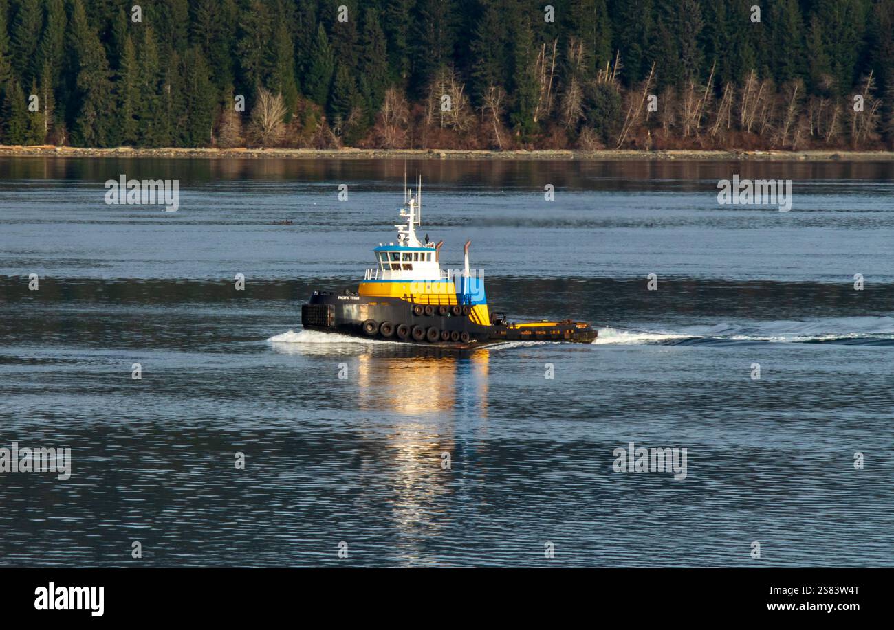 Small tugboat heading north in Discovery Channel, between Quadra Island and Vancouver Island on ...