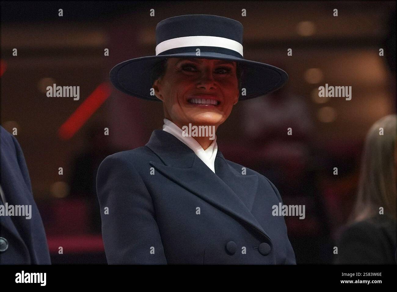 First lady Melania Trump smiles during an indoor Presidential ...