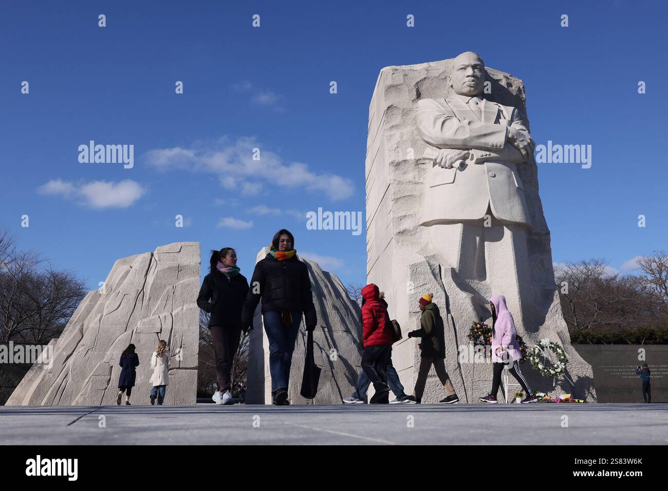 People walk by and pay their respects for Martin Luther King Jr. Day at ...