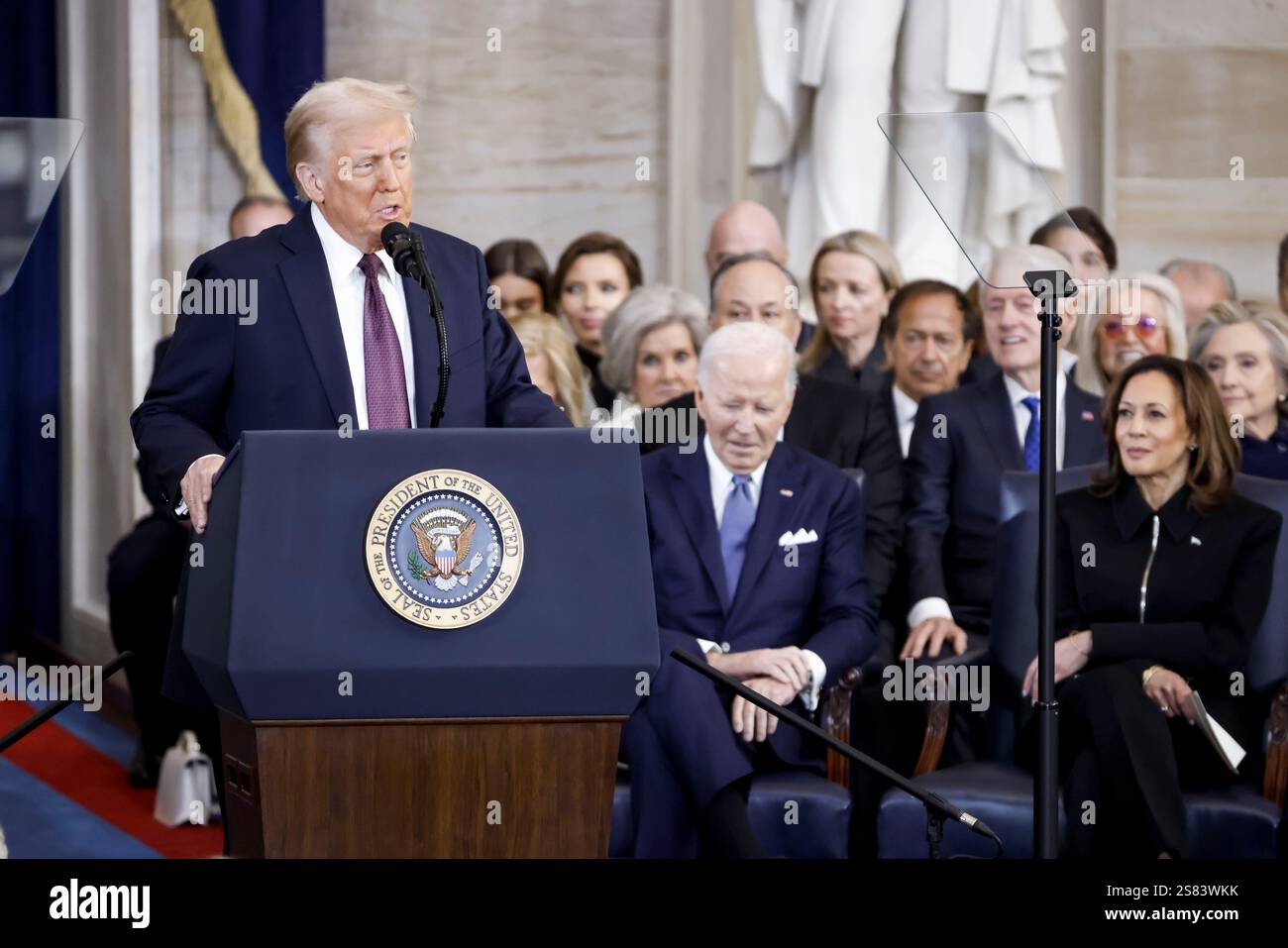 US President Donald Trump (L) delivers remarks after being sworn in as ...