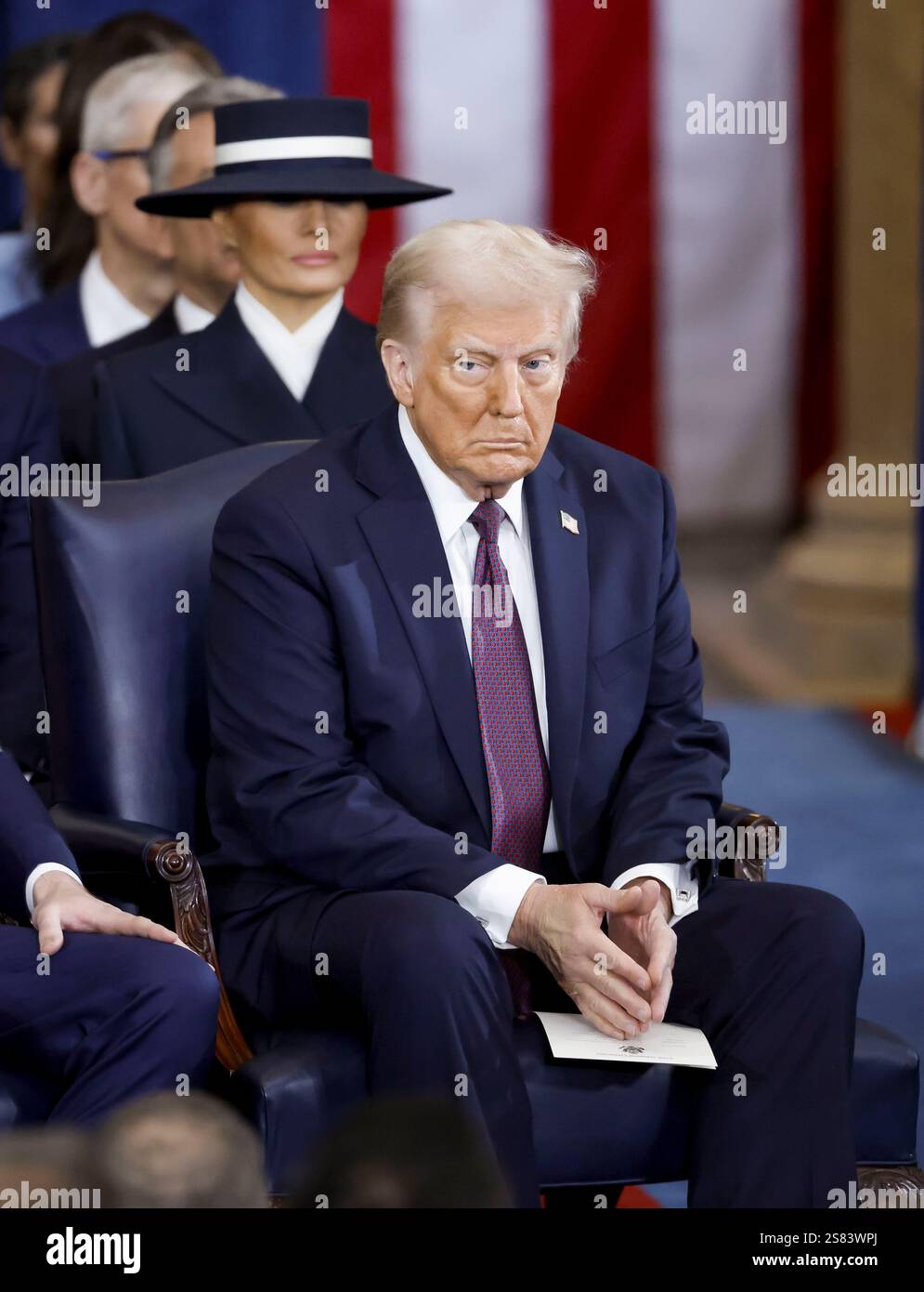 US President Donald Trump takes his seat as he arrives to be sworn in ...