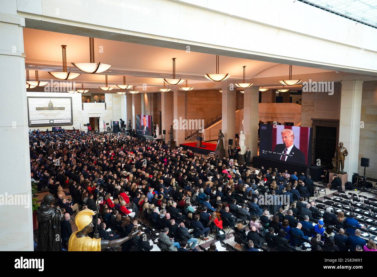 President Donald Trump is seen on screen in Emancipation Hall as he ...
