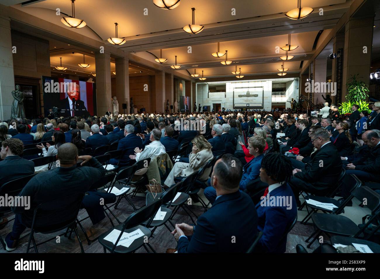 Guests and supporters are seen in an overflow room in Emancipation Hall ...
