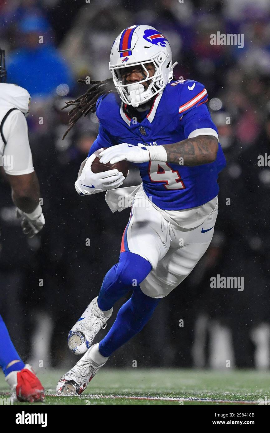 Buffalo Bills running back James Cook (4) runs with the ball during the ...