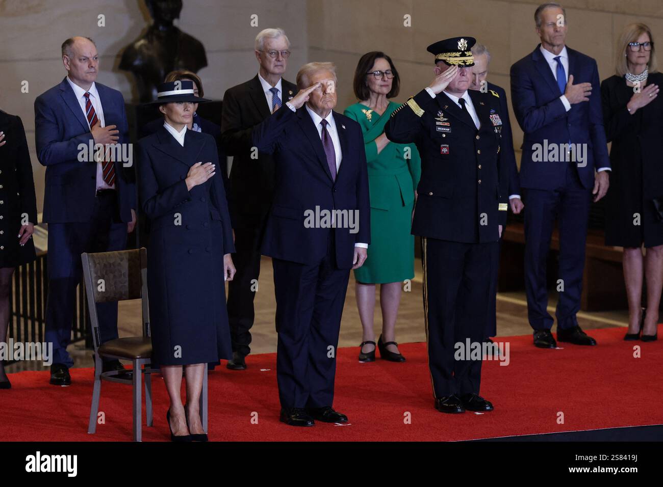 US President Donald Trump salutes the troops during the 60th ...