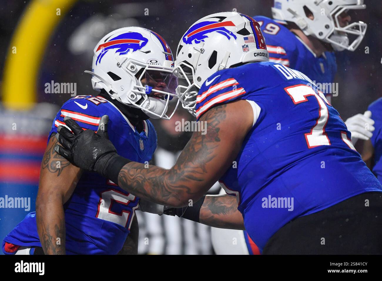 Buffalo Bills running back Ray Davis, left, celebrates with tackle Dion ...