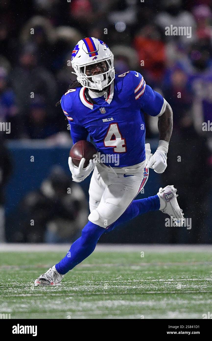 Buffalo Bills running back James Cook (4) runs with the ball during the ...