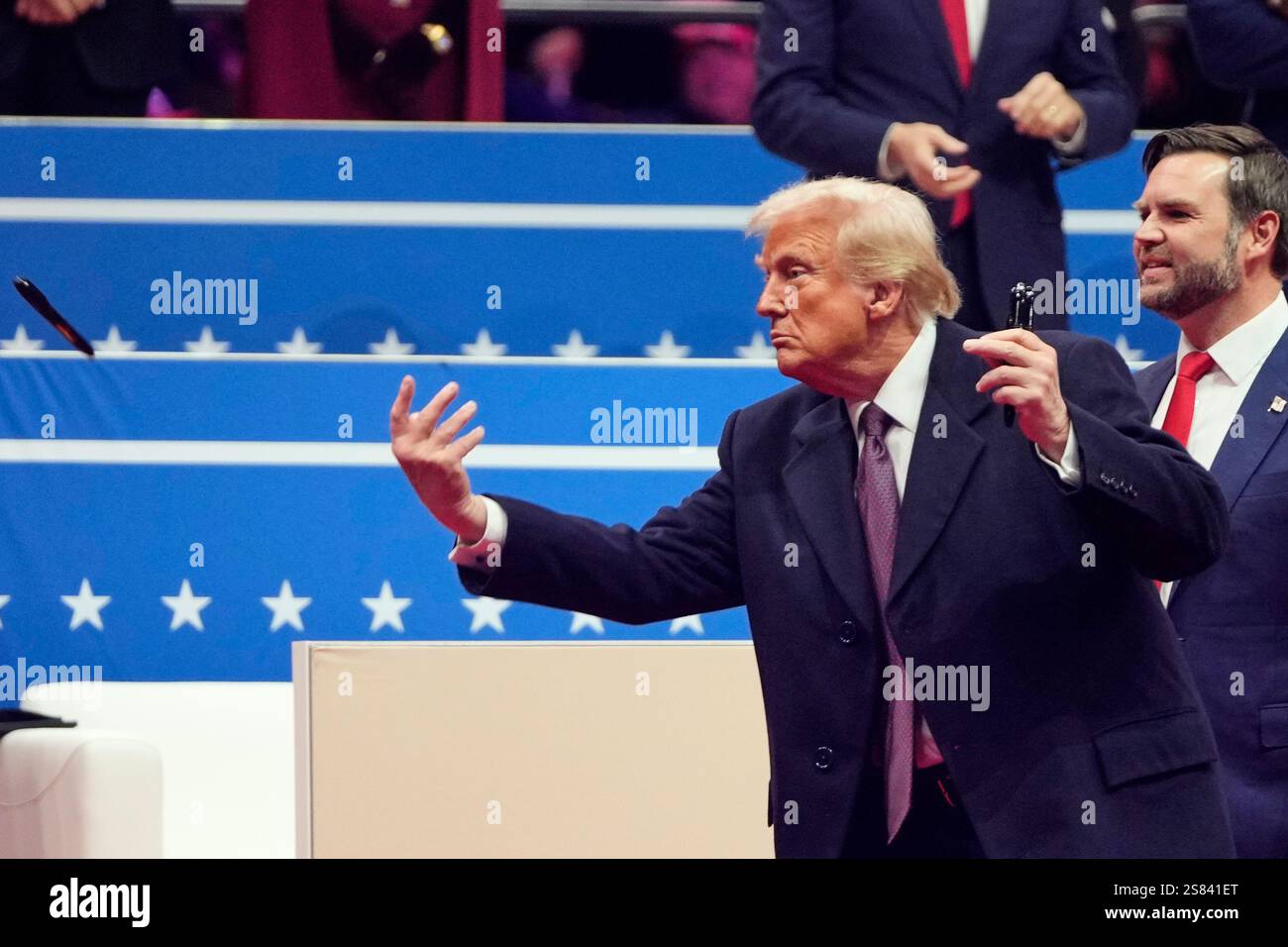 President Donald Trump throws pens into the crowd after signing ... President Donald Trump throws pens into the crowd after signing ...