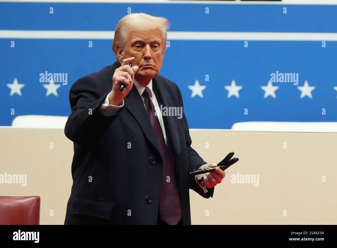 President Donald Trump throws pens used to sign executive orders to the ...