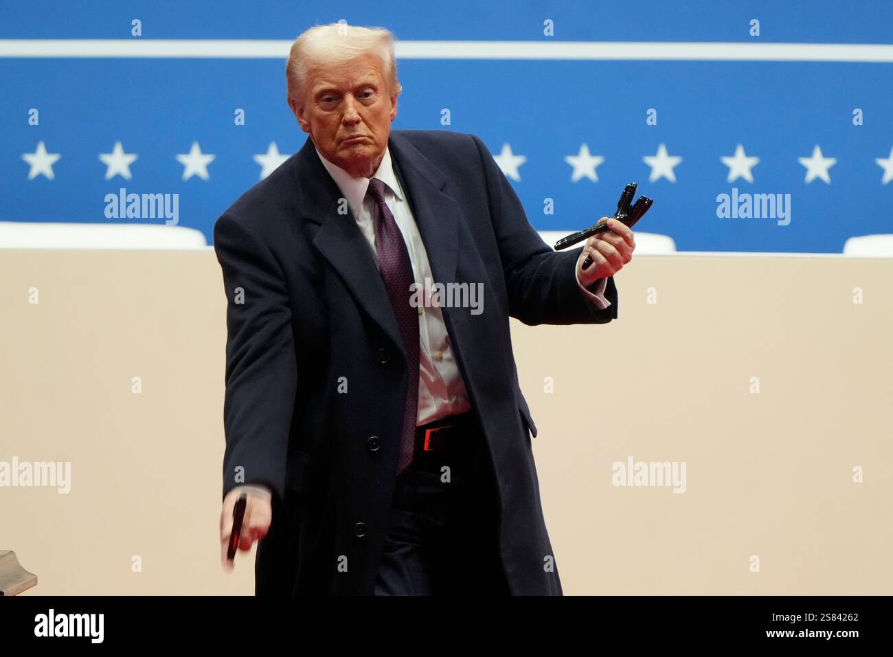 President Donald Trump throws pens used to sign executive orders to the ...