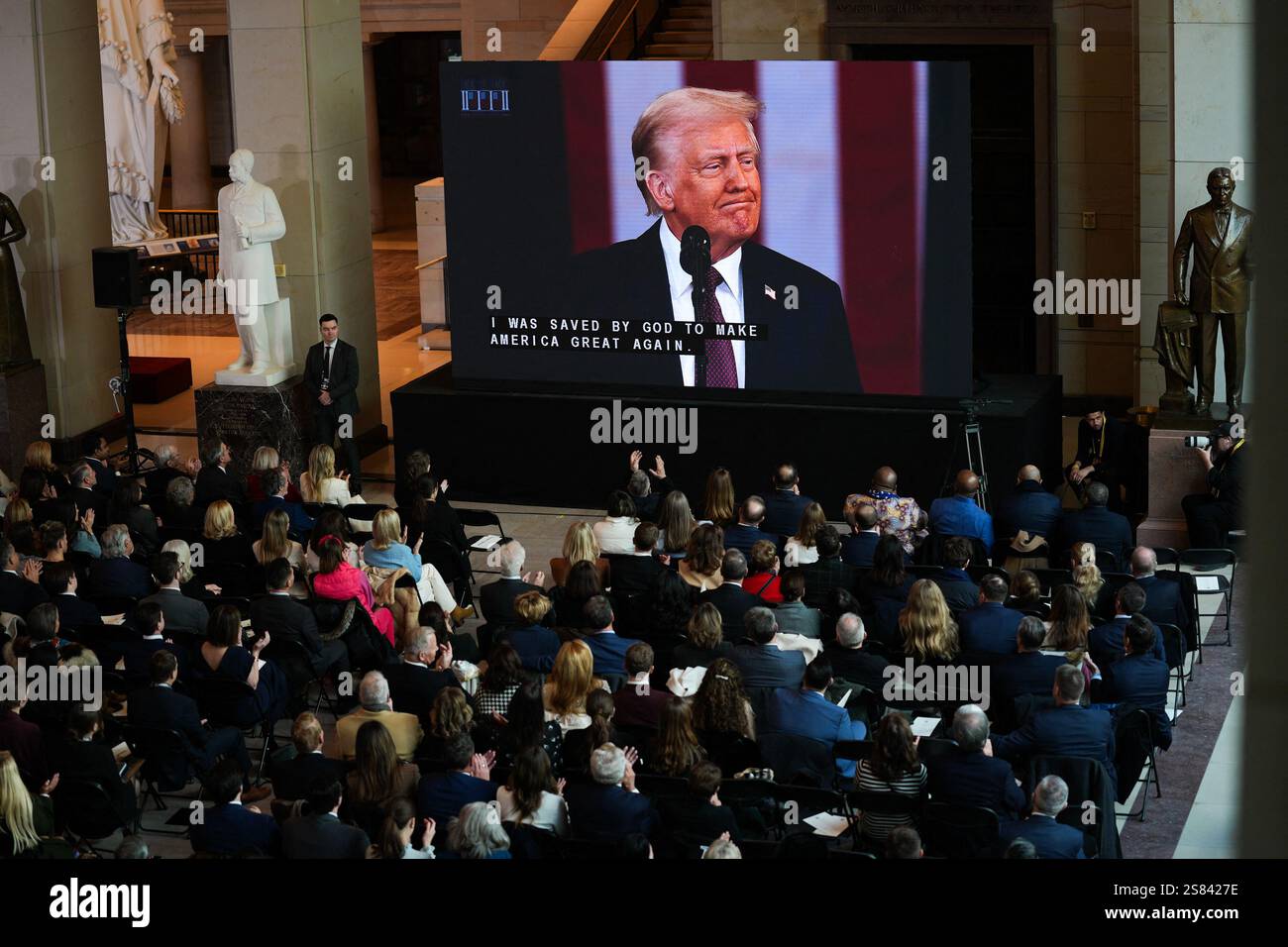 President Donald Trump is seen on screen in Emancipation Hall as he ...