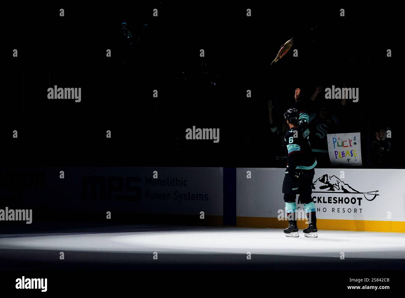Seattle Kraken defenseman Adam Larsson (6) throws a stuffed fish to ...