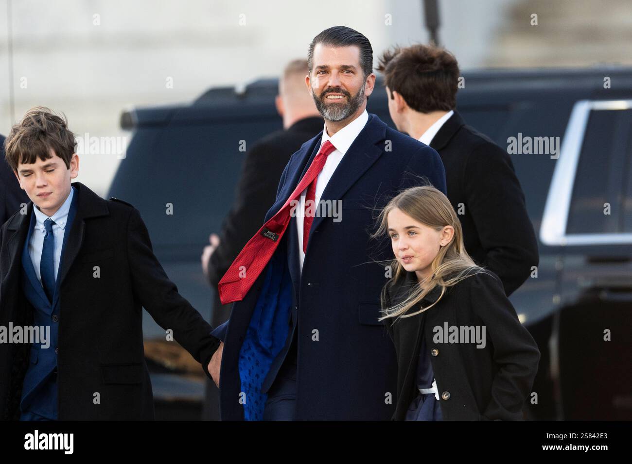 Donald Trump Jr., center, walks out of the U.S. Capitol, after ...