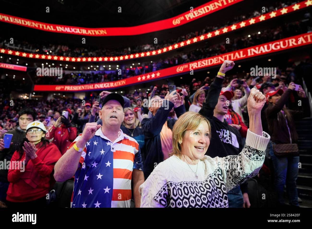 Supporters of President Donald Trump dance and cheer inside Capital One ...