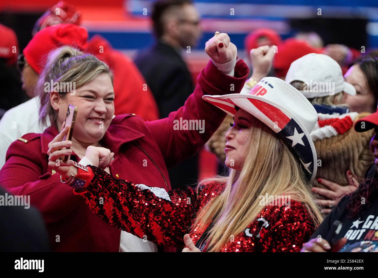 Supporters of President Donald Trump dance and cheer inside Capital One ...