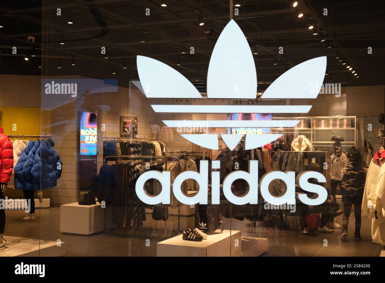 adidas store brand logo Stock Photo - Alamy