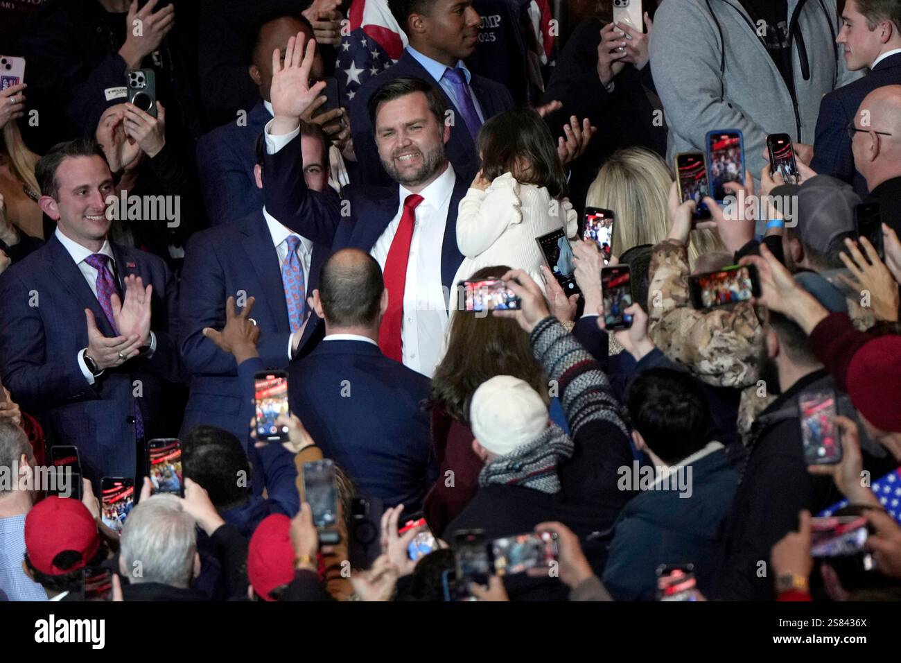 Vice President JD Vance, holding his daughter Mirabel, arrives at an ...