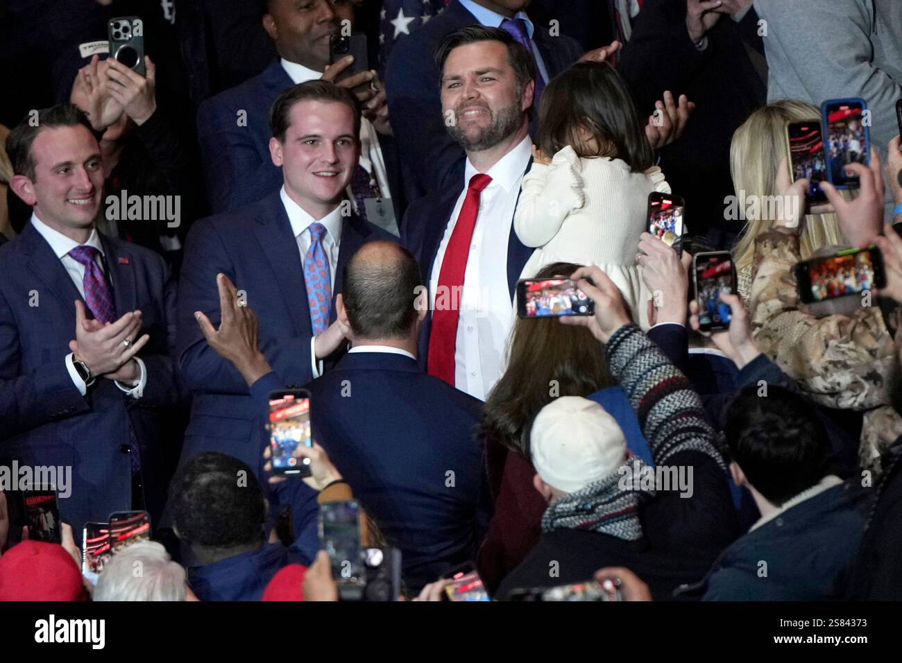 Vice President JD Vance, holding his daughter Mirabel, arrives at an ...