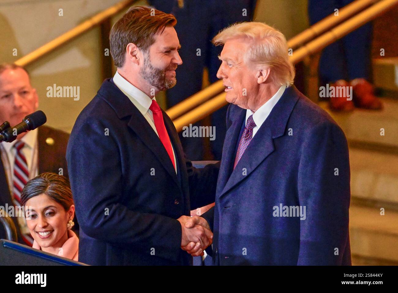 Vice President JD Vance, left, and President Donald Trump, right, shake ...